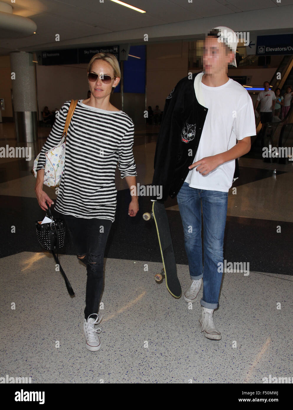 Amber Valletta and son Auden at Los Angeles International Airport (LAX ...