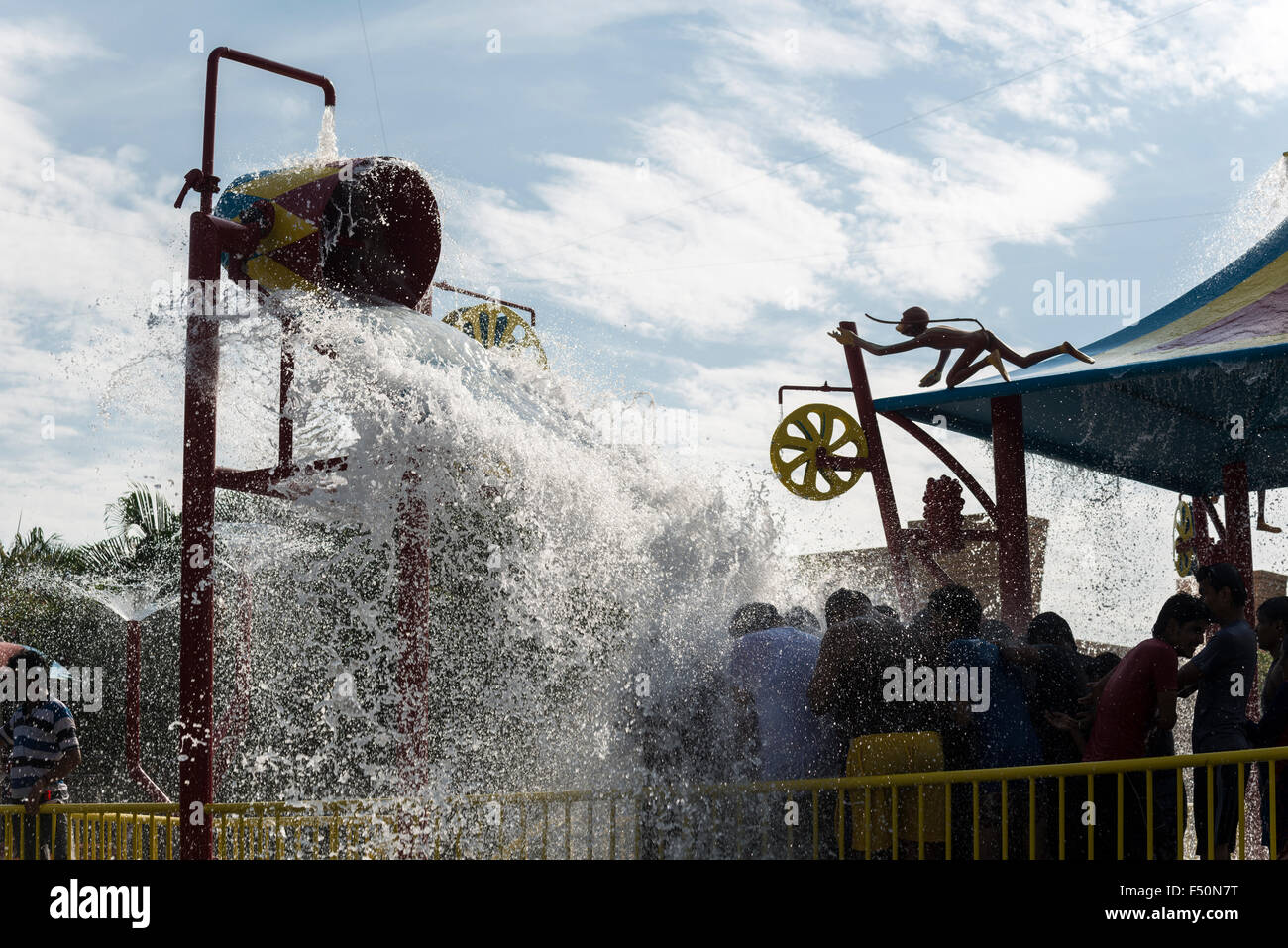 People play in water fountains at Wonder La, the big amusement park ...