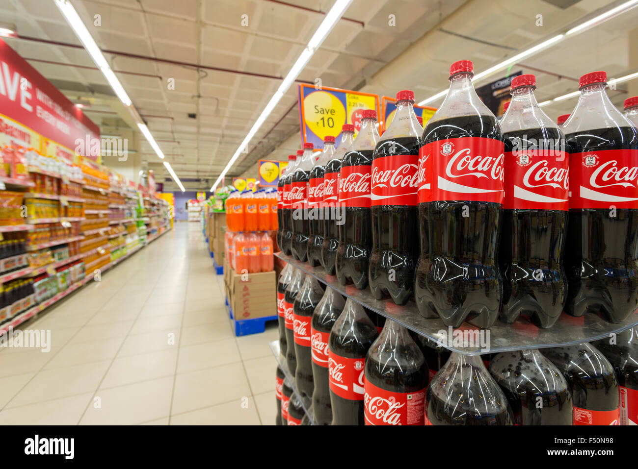 Different goods are for sale with discount in a big modern supermarket ...