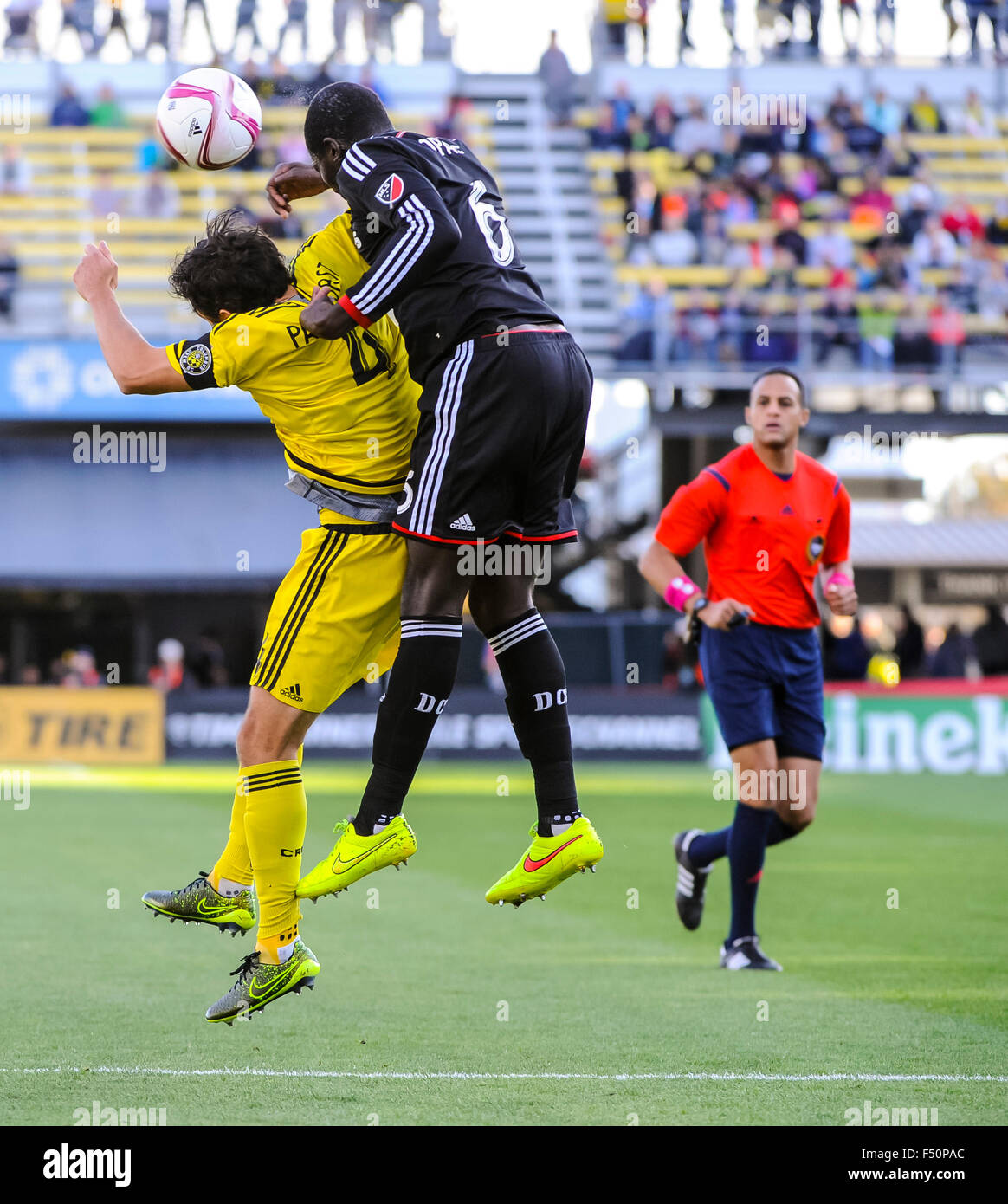 Kofi Opare (6) of D.C. United and Michael Parkhurst (4) of Columbus ...