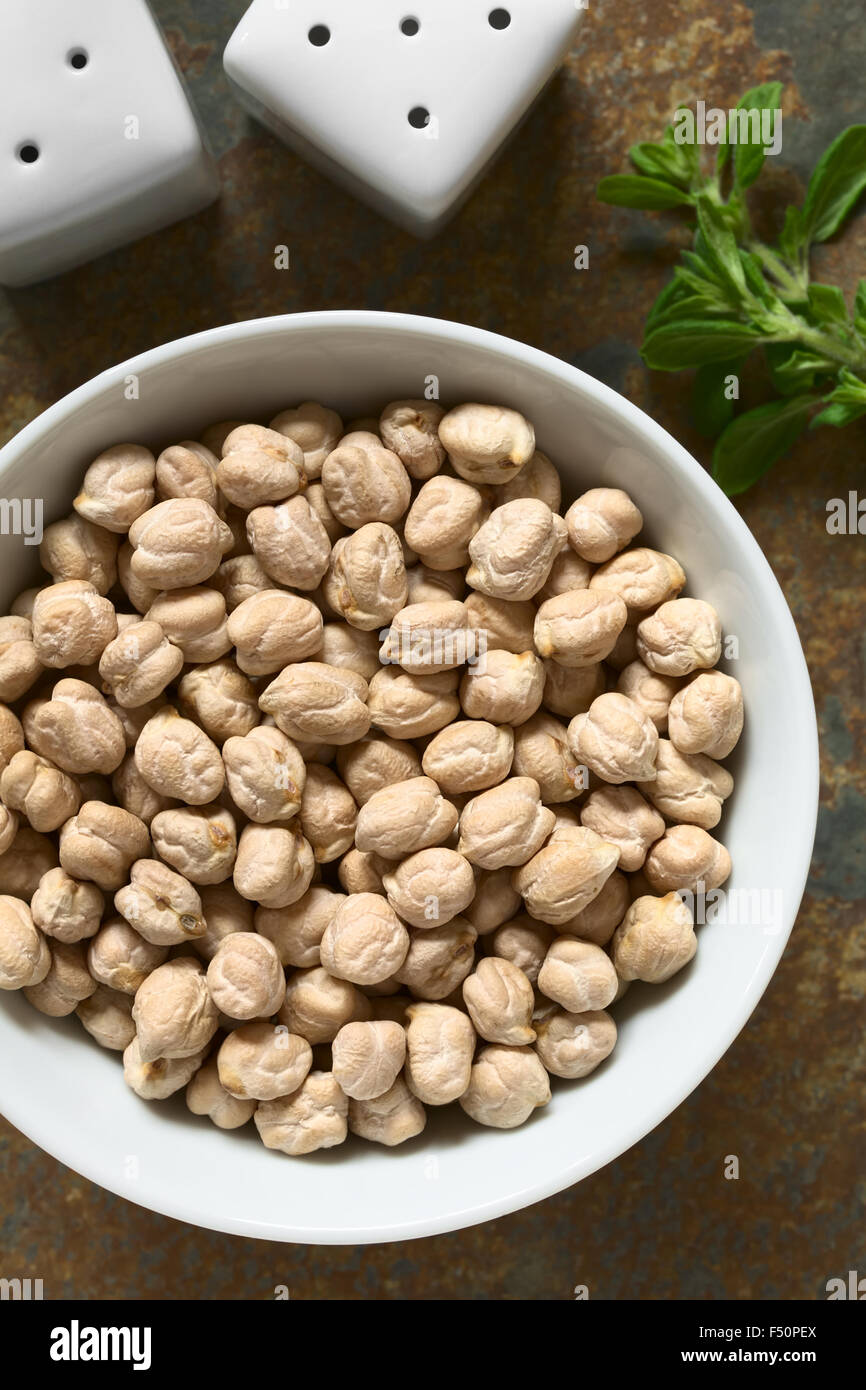 Raw chickpeas or garbanzo beans in bowl, photographed overhead with ...