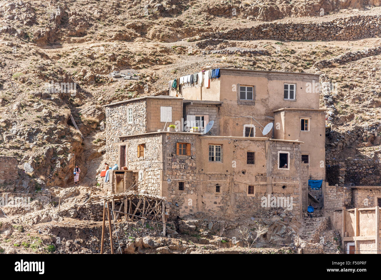 Typical Berber village stone house built into the mountainside, Toubkal ...