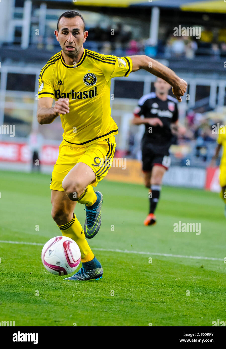 Justin Meram (9) of Columbus Crew charges forward to get a gaol in the ...