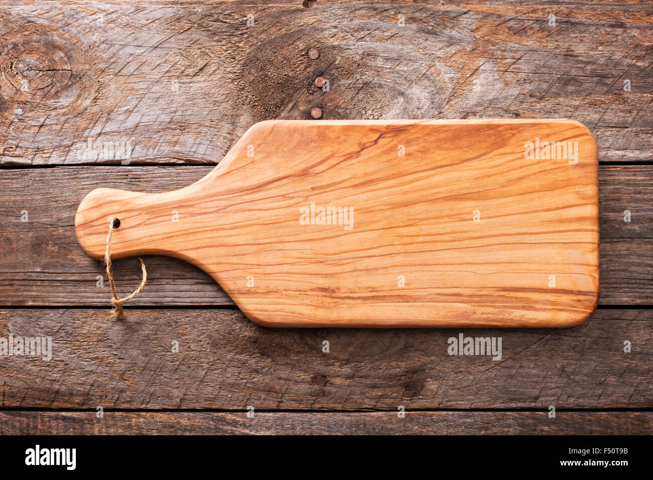 Wooden rustic background with a brown cutting board Stock Photo - Alamy