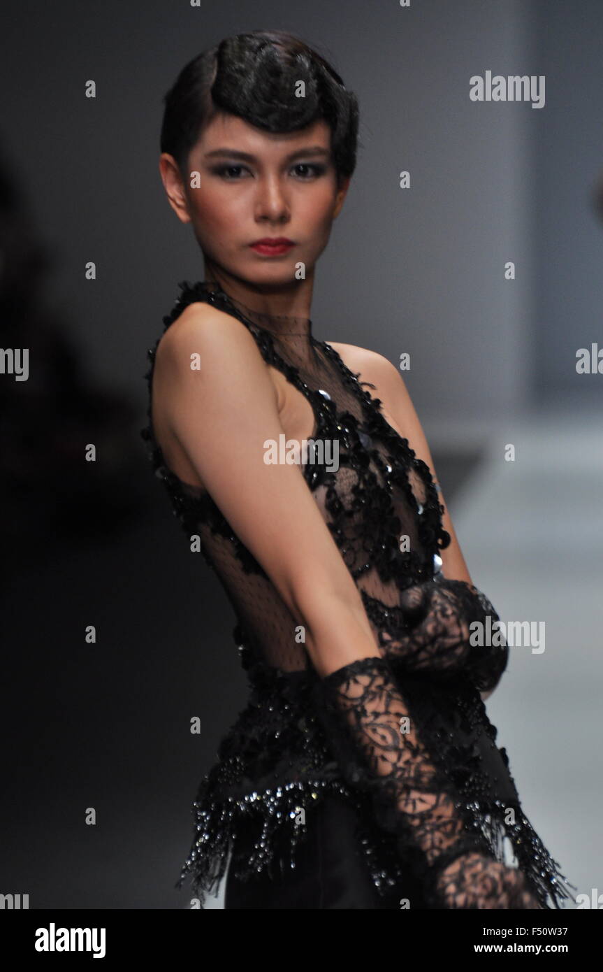 Jakarta, Indonesia. 25th Oct, 2015. A model wears a design of Maison BA ...