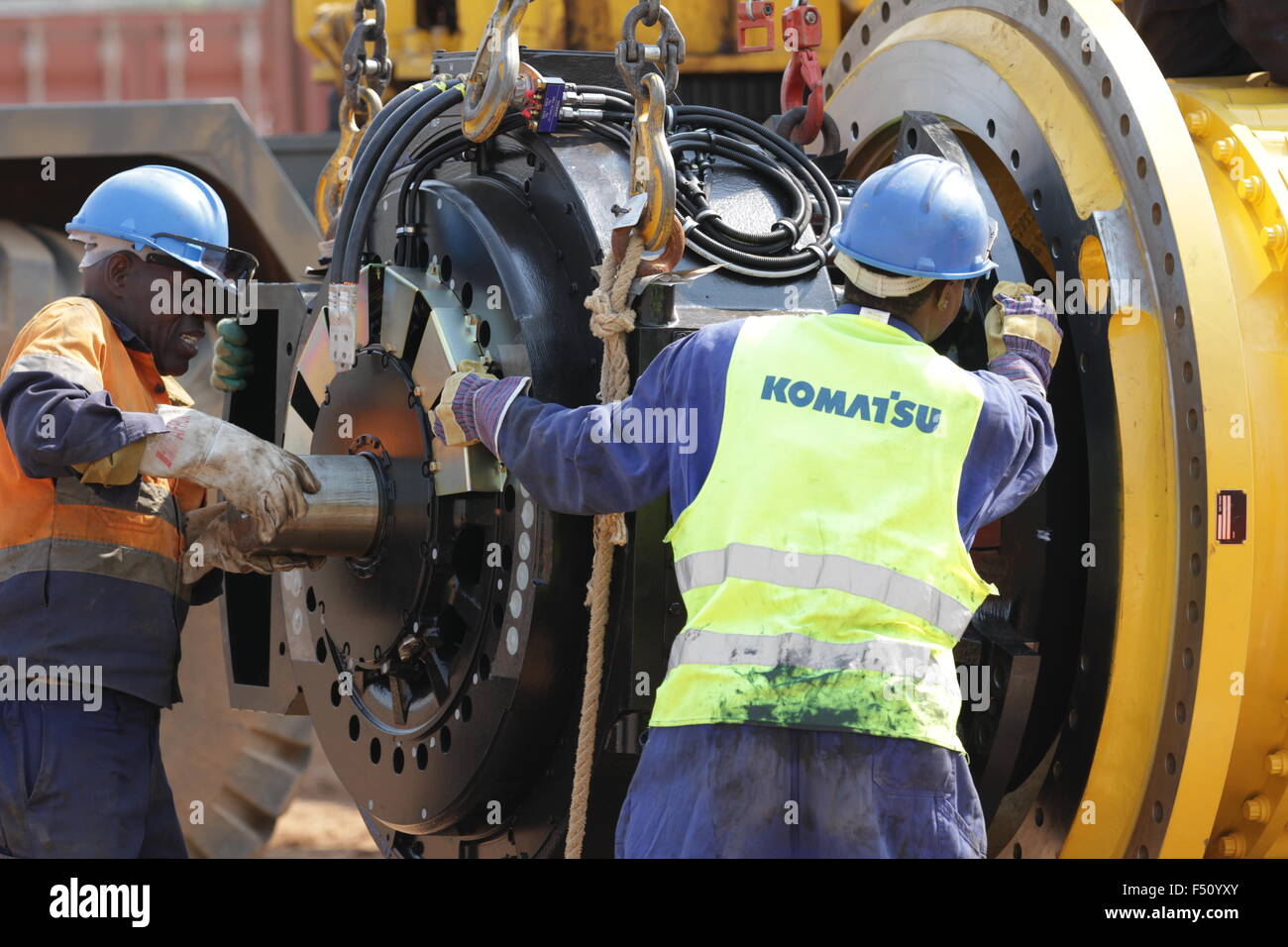 Installing large electric wheel motor for large haul truck. Mining in ...