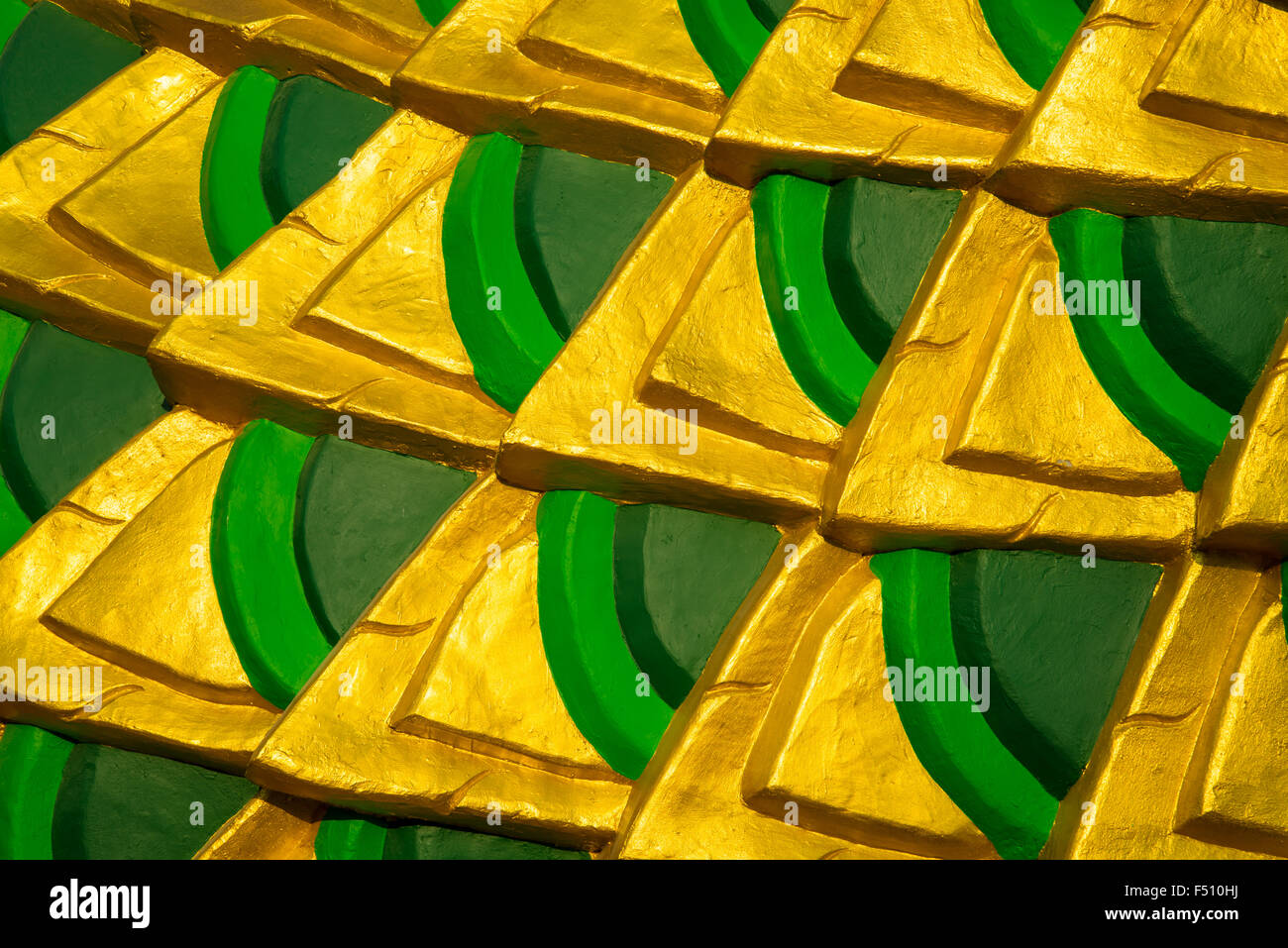 detail of a golden and green naga for background Stock Photo - Alamy