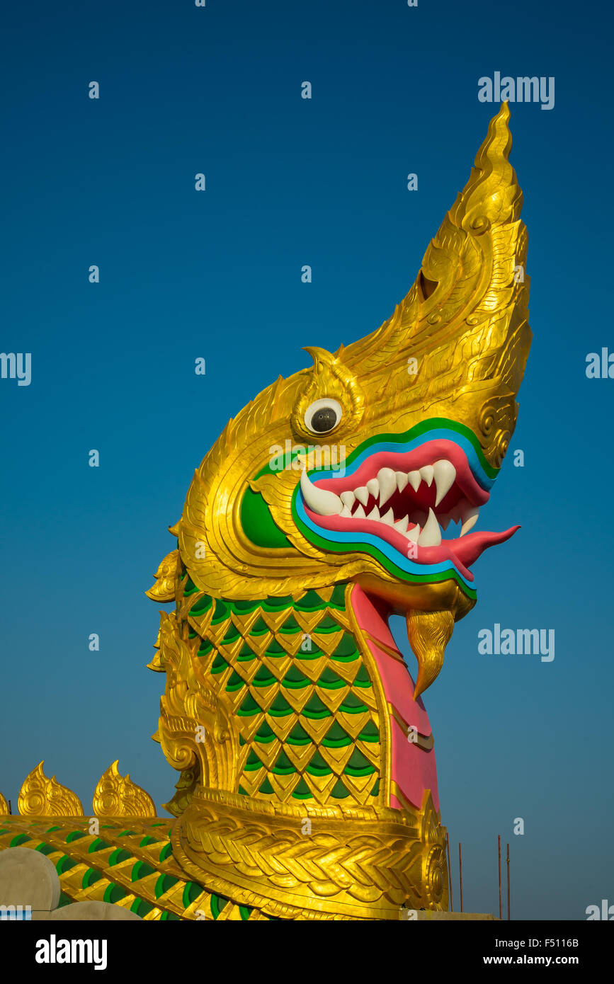Large golden naga on the blue sky background Stock Photo - Alamy