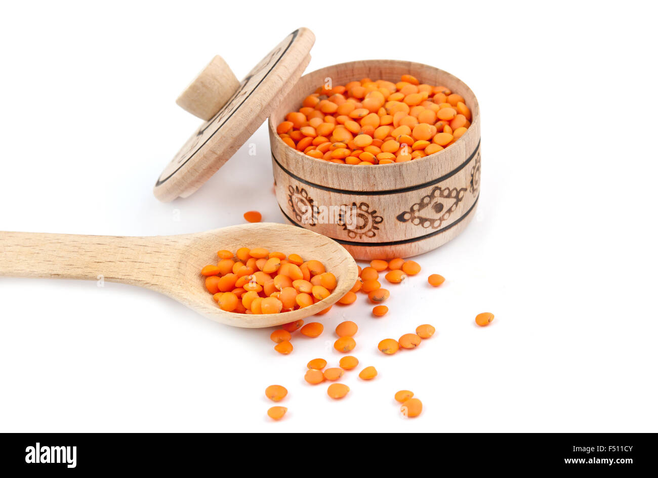 dry red lentils in a wooden dishes macro Stock Photo - Alamy
