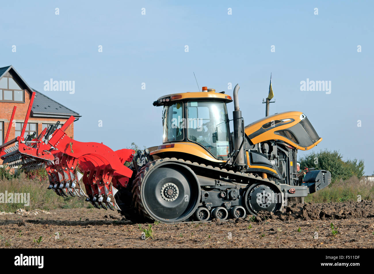 worker repairing the tractor on the field Stock Photo - Alamy