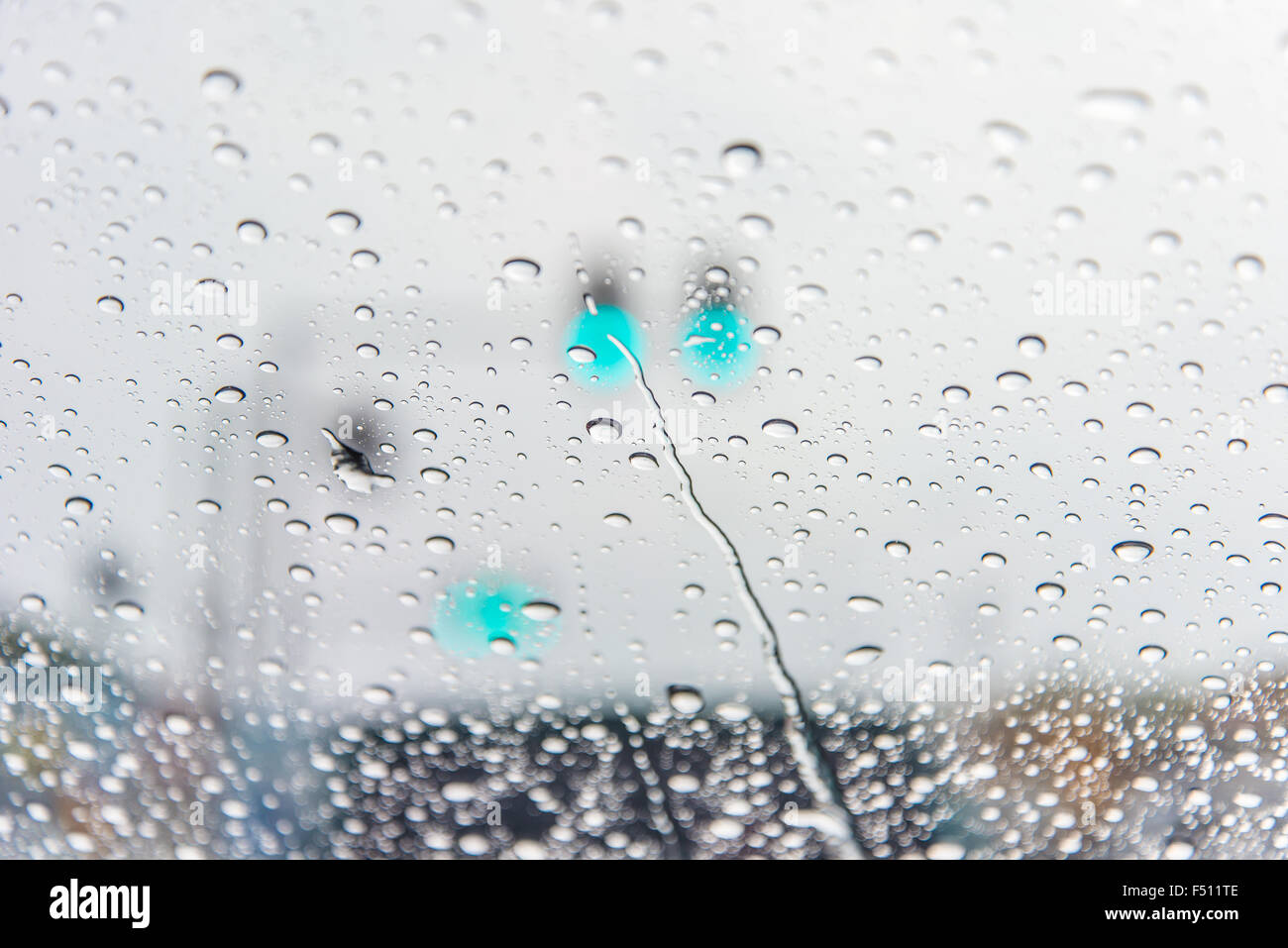 Zoom shot out of focus water droplets on glass Stock Photo - Alamy