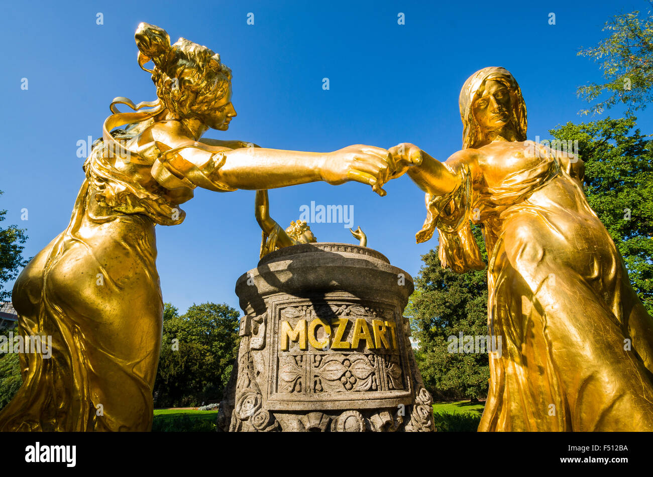 Dancing golden sculptures as an hommage to Mozart Stock Photo - Alamy