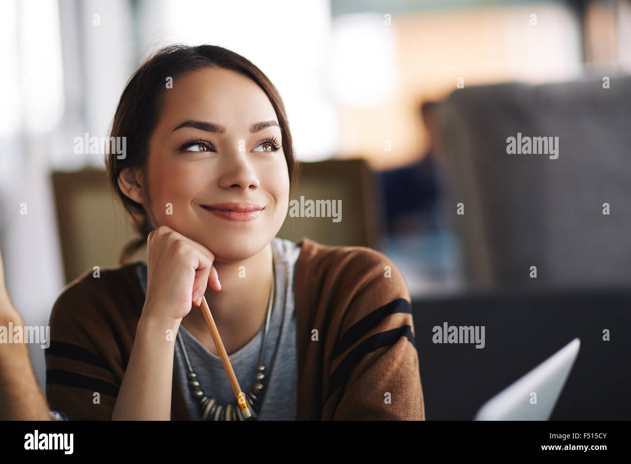 Happy girl looking sideways with smile Stock Photo - Alamy