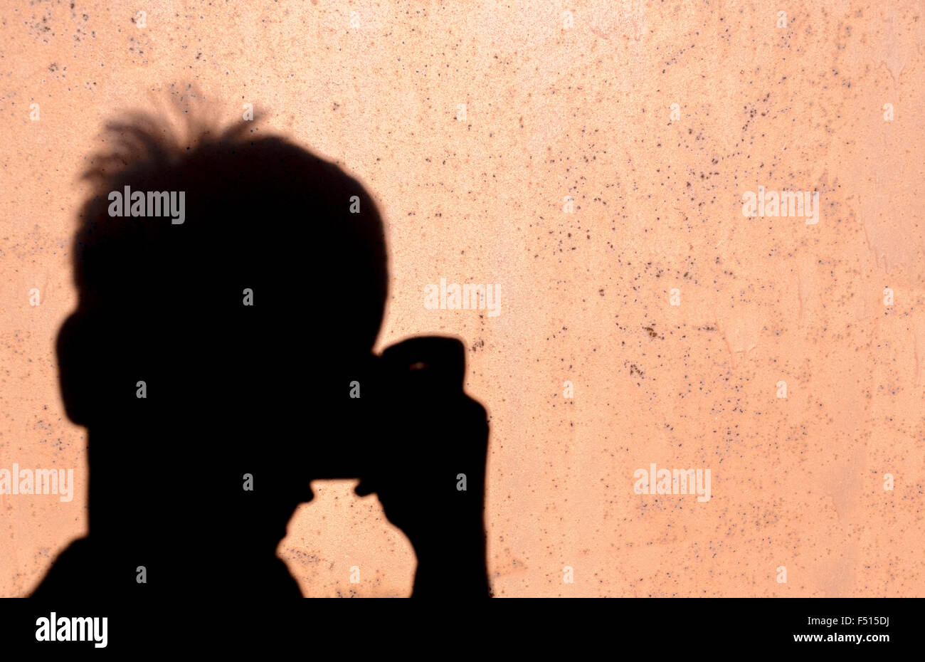 Blurred shadow of the photographer on a rusty metal surface Stock Photo ...
