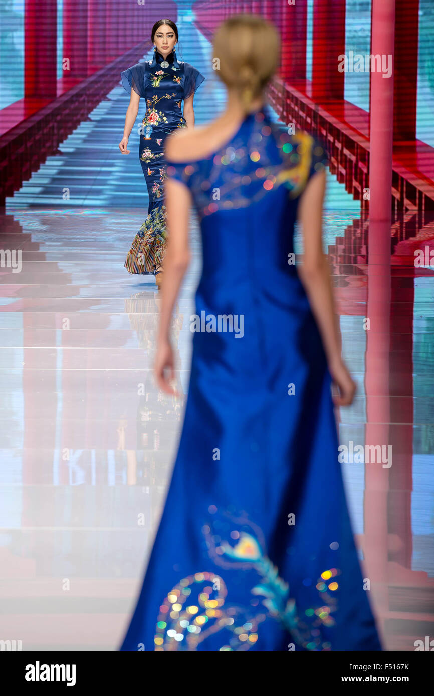 Beijing, China. 25th Oct, 2015. A model presents a Qipao (cheongsam ...