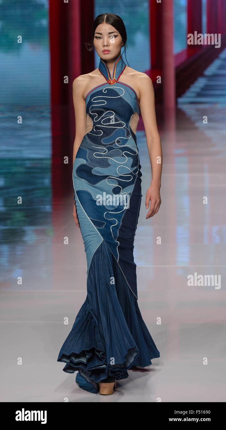 Beijing, China. 25th Oct, 2015. A model presents a Qipao (cheongsam ...