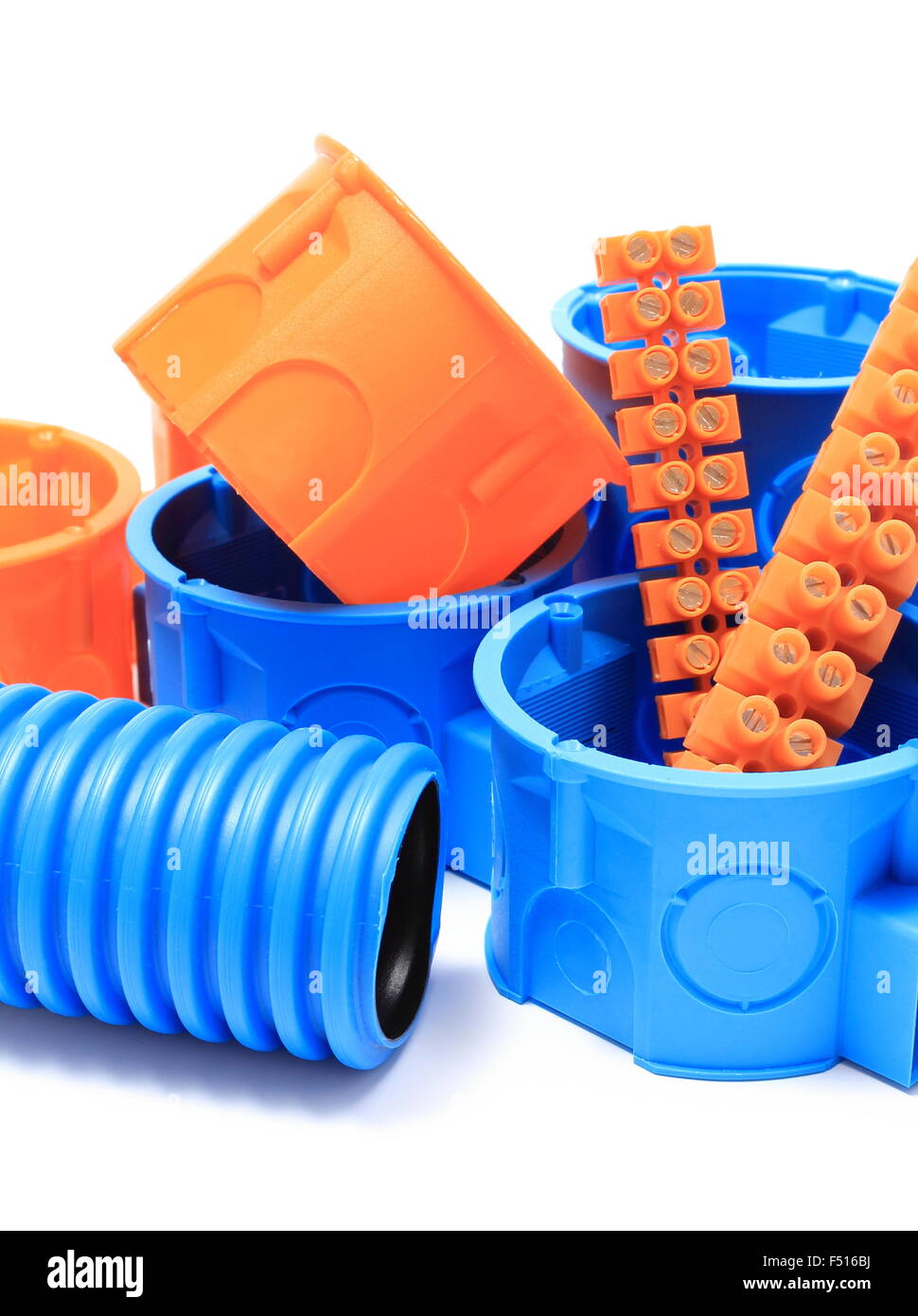 Orange and blue electrical boxes with components for use in electrical ...