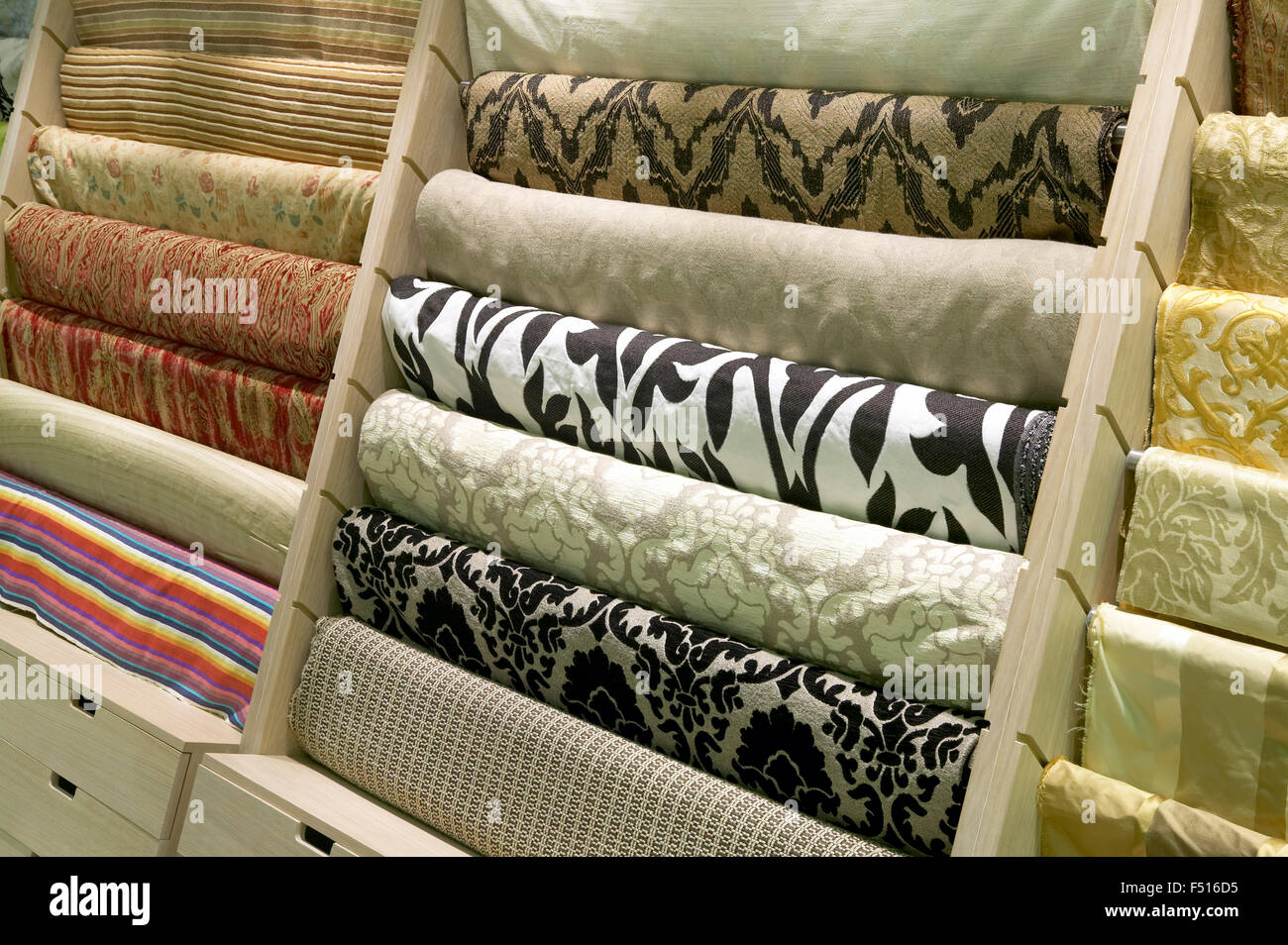 Rolled up satin in a fabric shop Stock Photo - Alamy