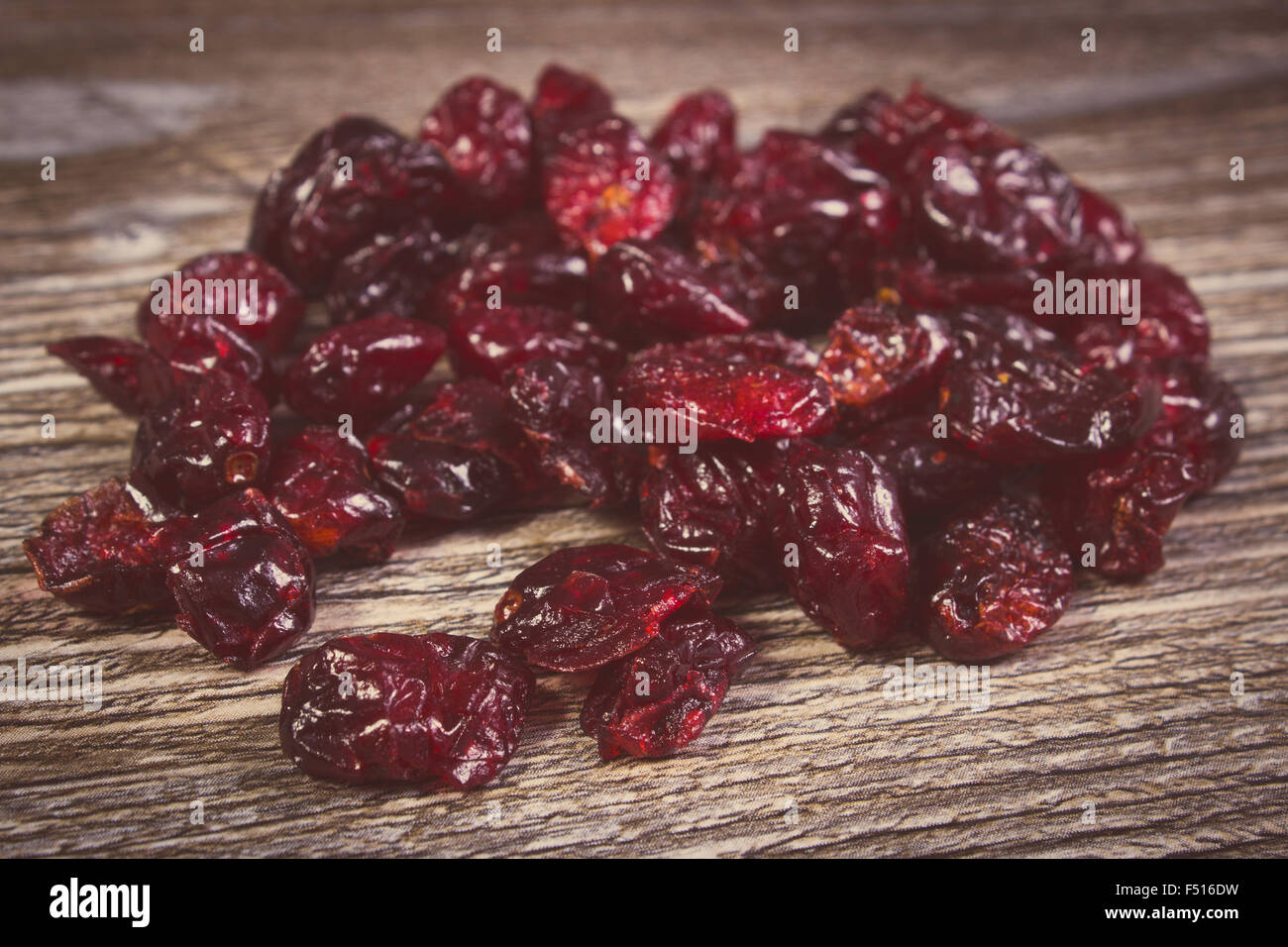 Vintage photo, Heap of red cranberries on wooden table, concept for ...