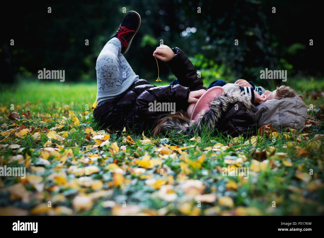 Girl laying on the ground hi-res stock photography and images - Alamy