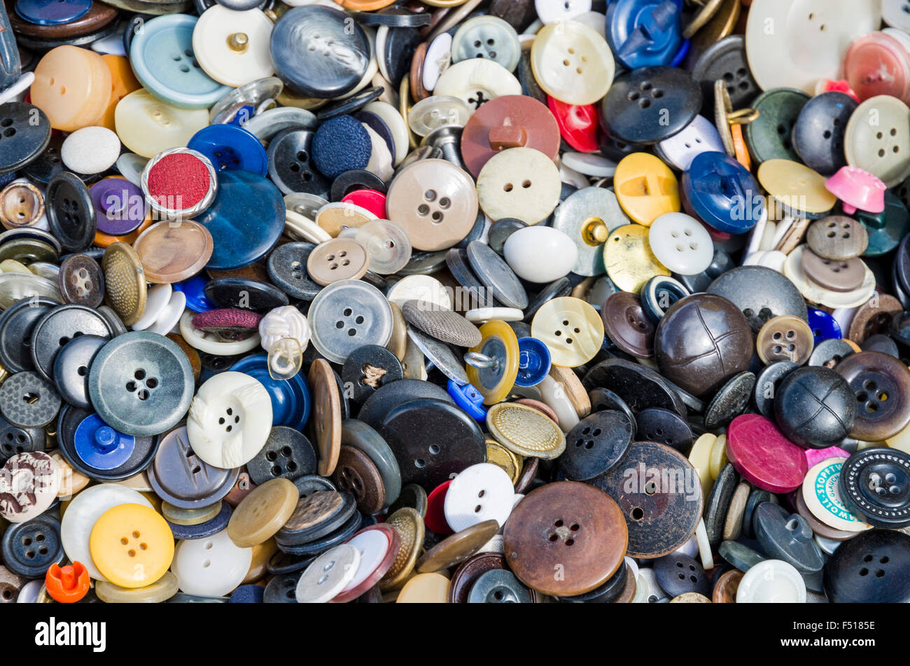 A bunch of colorful buttons are offered for sale at the weekly flea ...