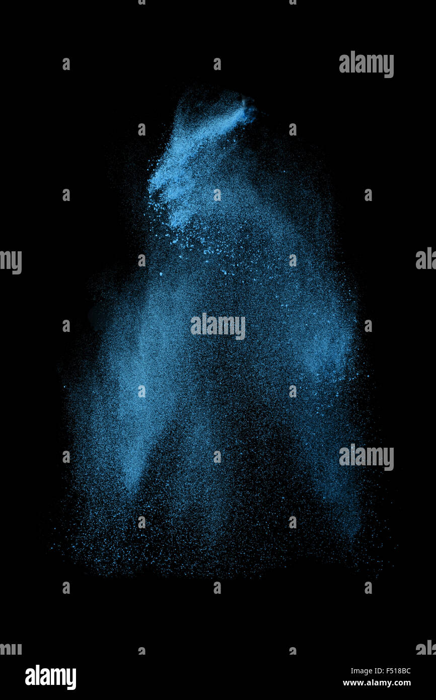 Abstract design of blue powder cloud against dark background Stock ...