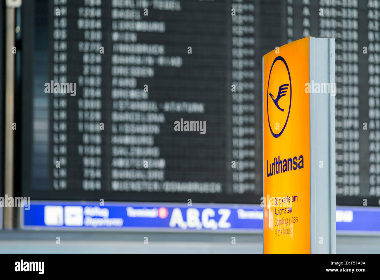 An illuminated signpost of the airline Lufthansa in front of the ...