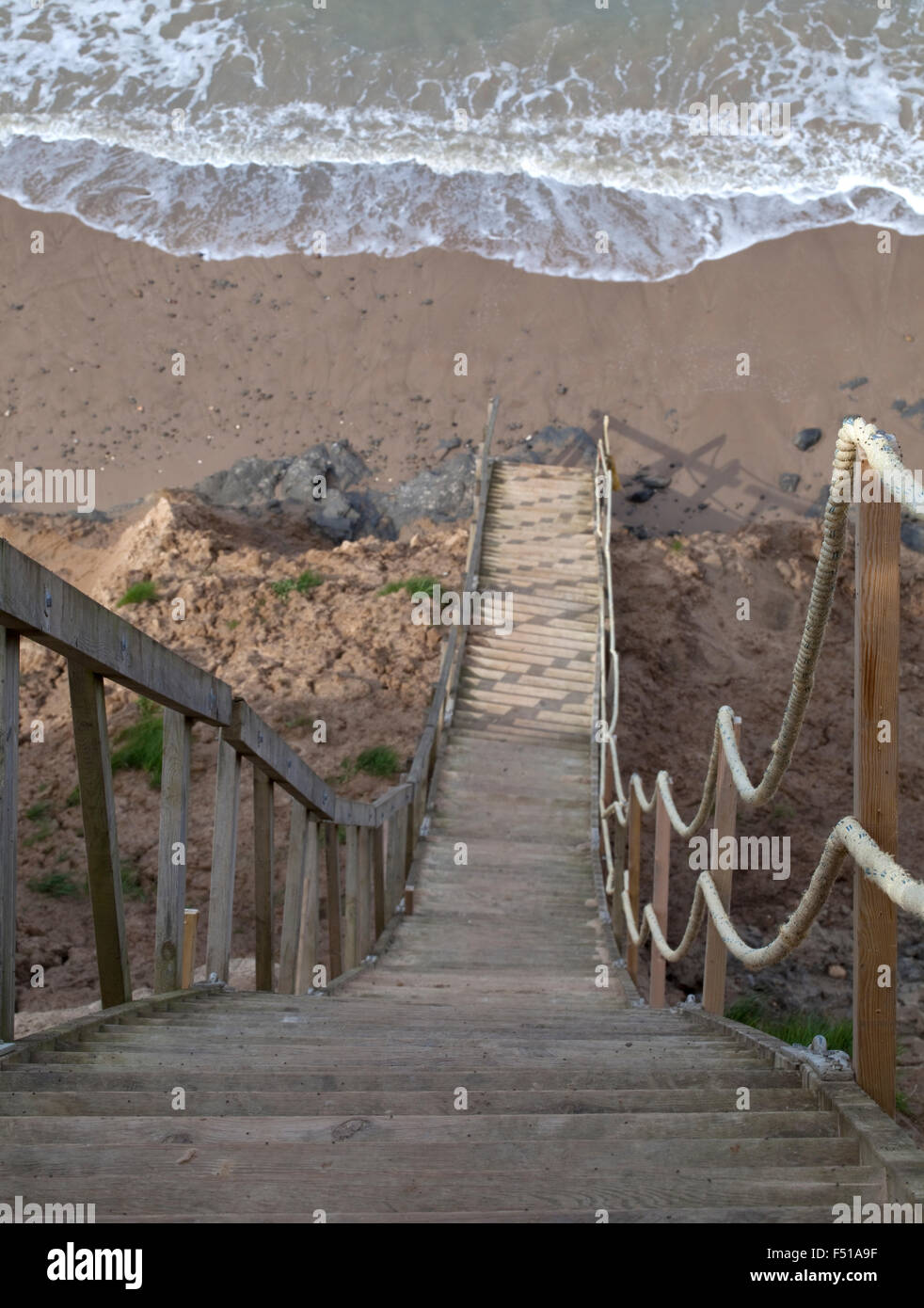 A steep staircase traverses an unstable cliff side to get people down ...