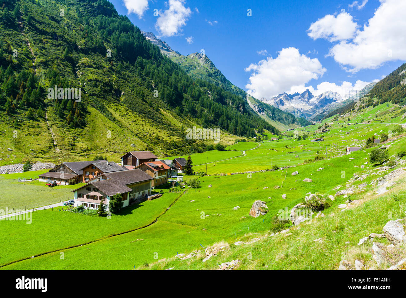 High altitude landscape with some farmers houses, mountains and green ...