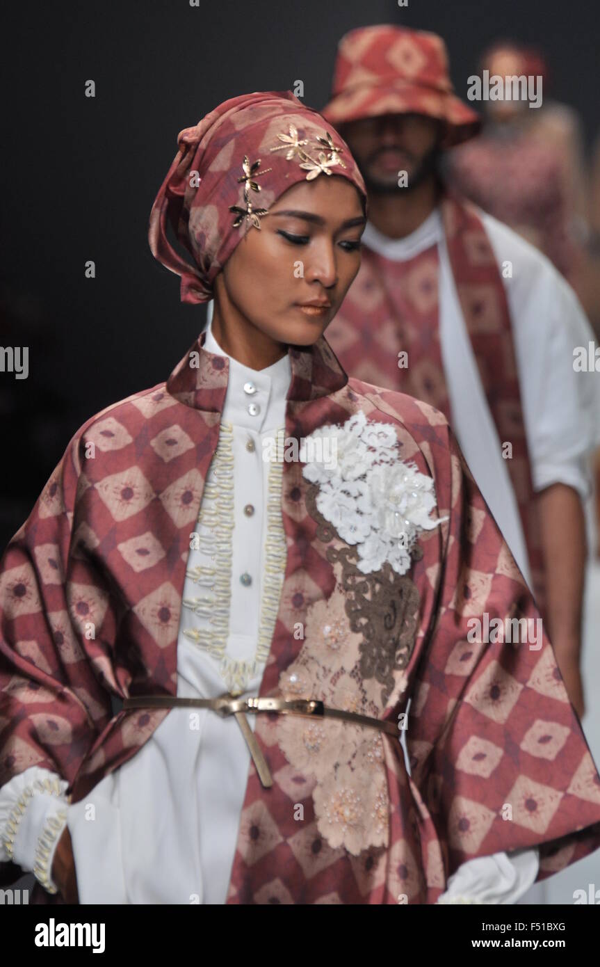 Jakarta, Indonesia. 25th Oct, 2015. A model wears a design of ...
