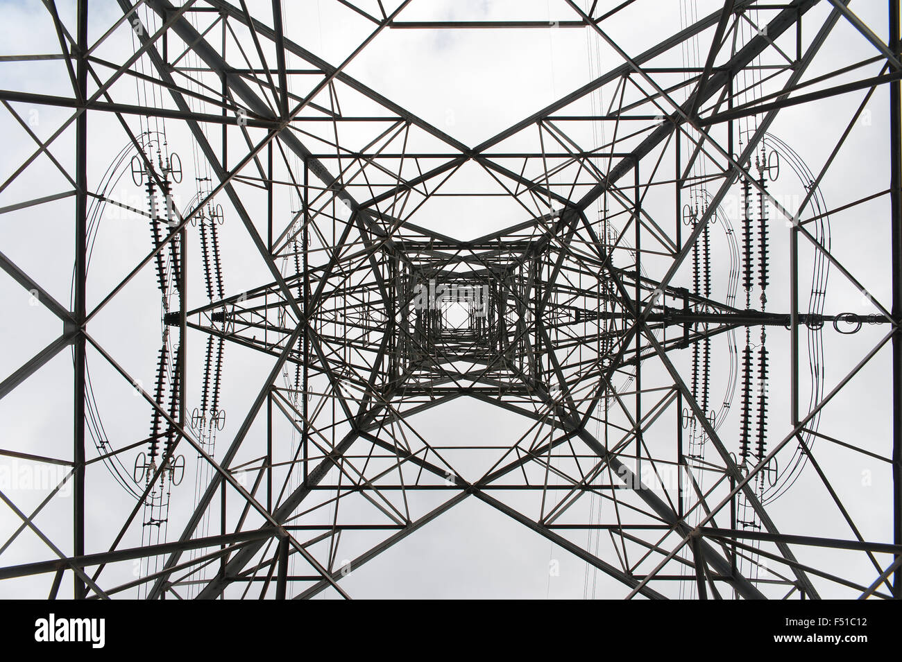 Filming electrical tower from below of it Stock Photo - Alamy