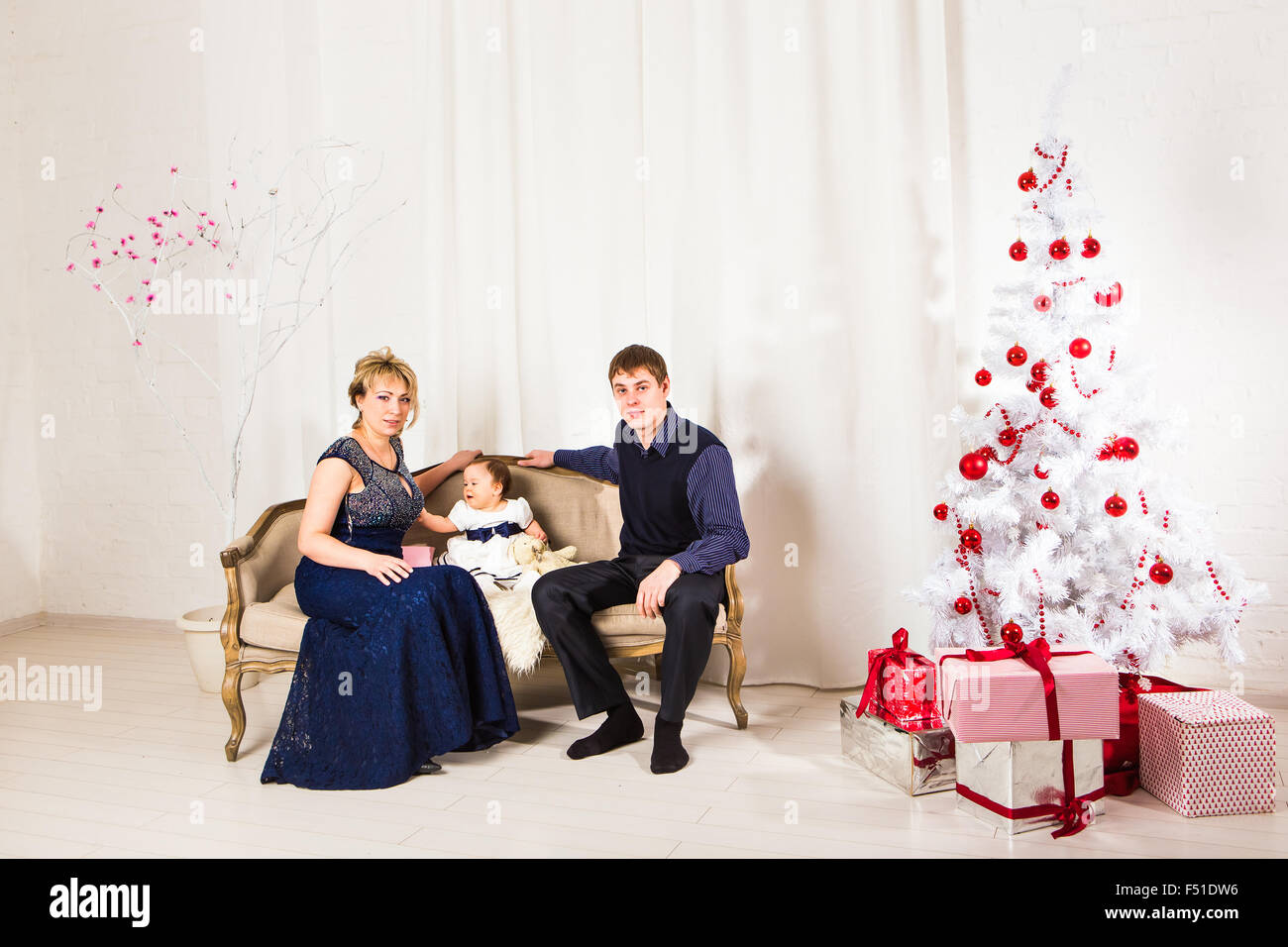 Christmas family of three persons and fir tree with gift boxes Stock ...