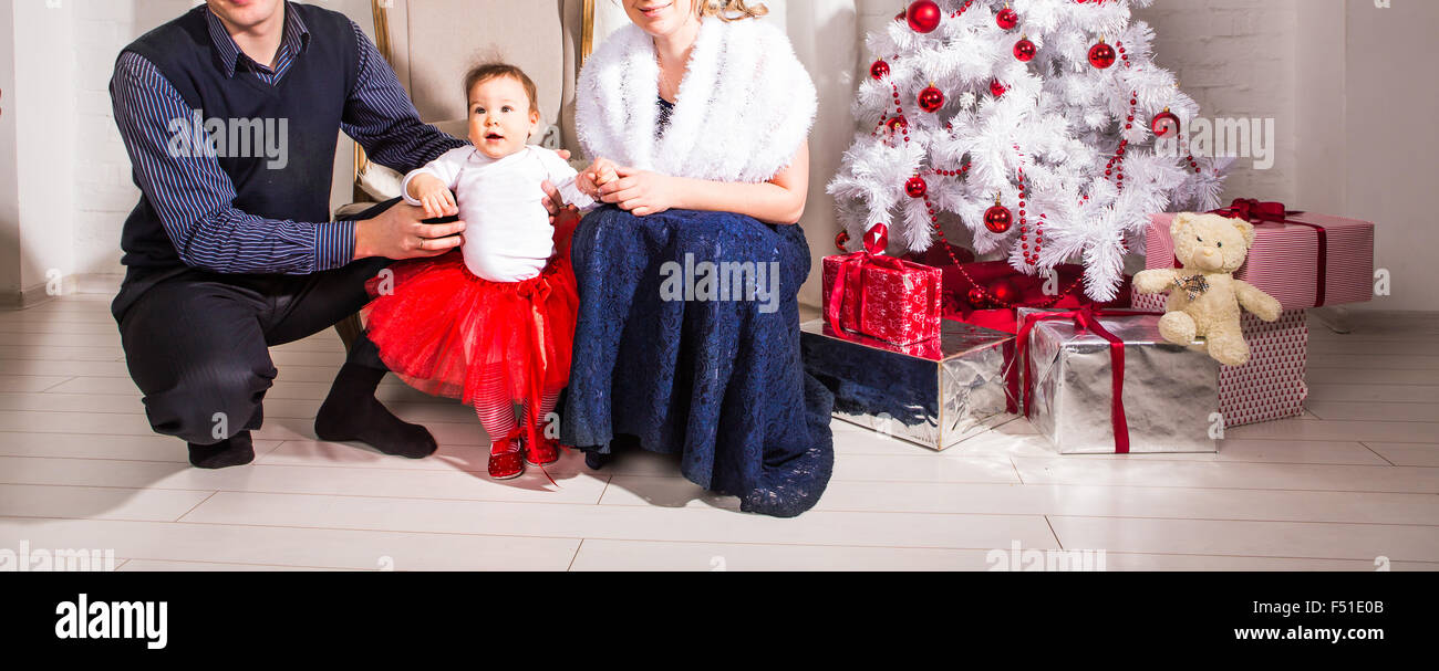 Portrait of happy family with Christmas tree Stock Photo - Alamy