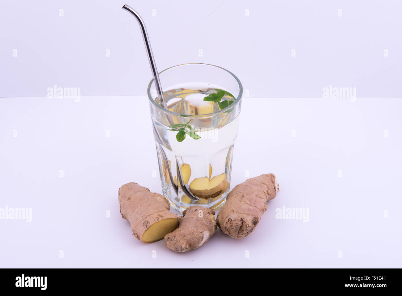 glass of ginger tea on white background Stock Photo - Alamy