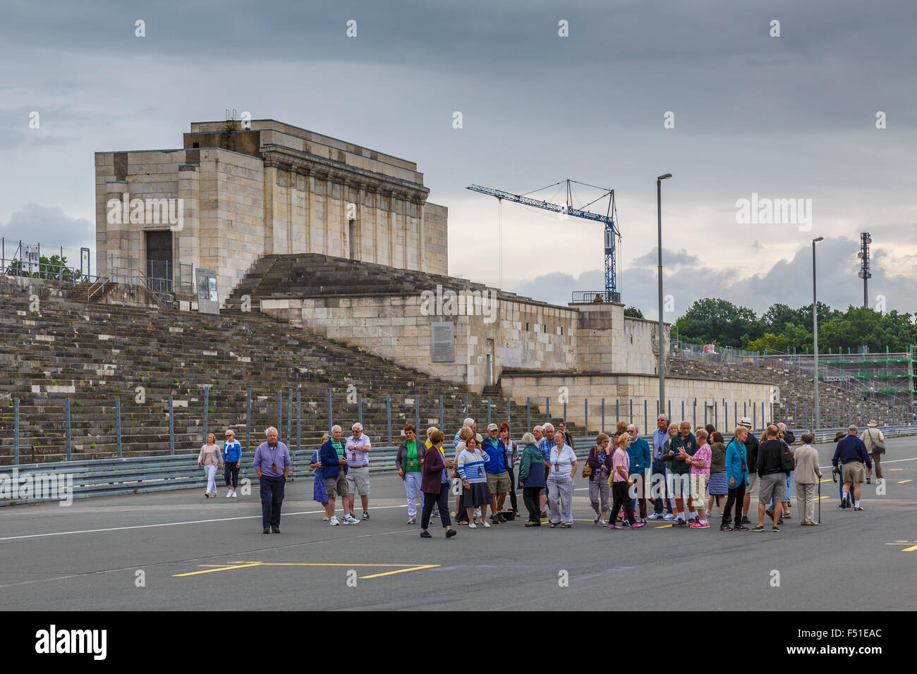 Tourists at the Zeppelinfeld, main tribune, on the site of the Nazi ...