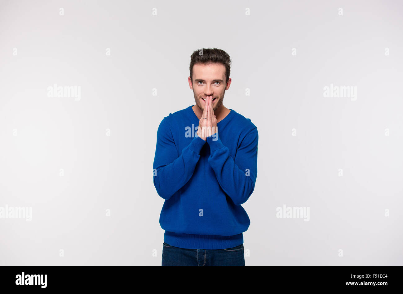Portrait of a happy man praying isolated on a white background Stock ...
