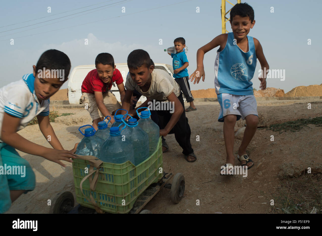 Kids running around the tents in the UN refugee camp near Zahle in the ...