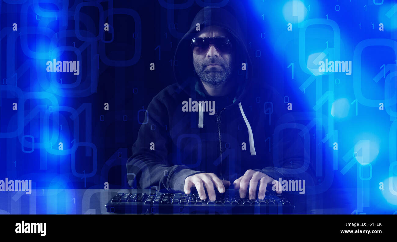 Hacker instaling virus in attacked system network Stock Photo - Alamy