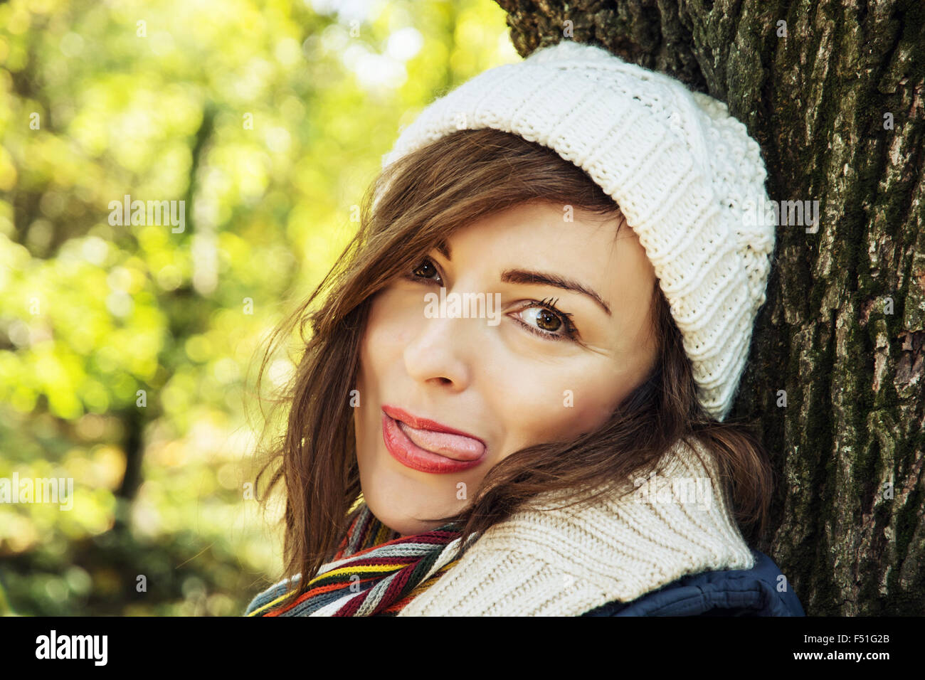 Young crazy positive woman posing in autumn park. Beauty, fashion and ...