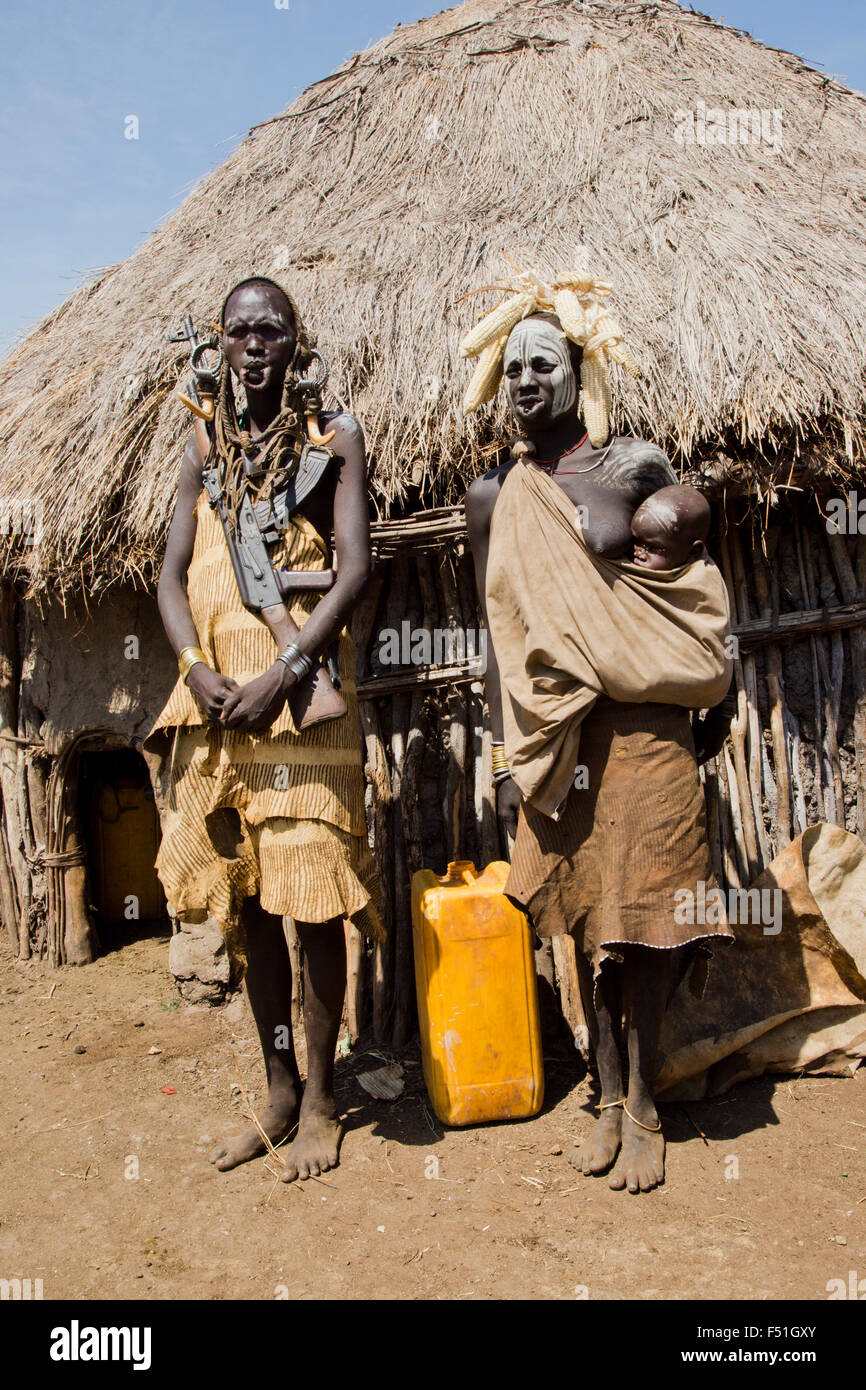 Mursi couple. The woman has an elongated lower lip to hold a clay disk ...