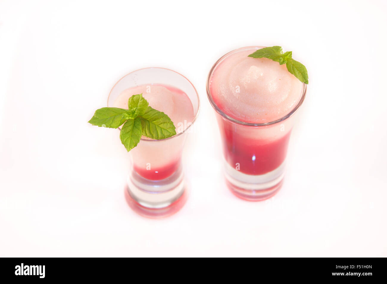 Whipped semolina pudding, mint and rhubarb jam, isolated on white ...