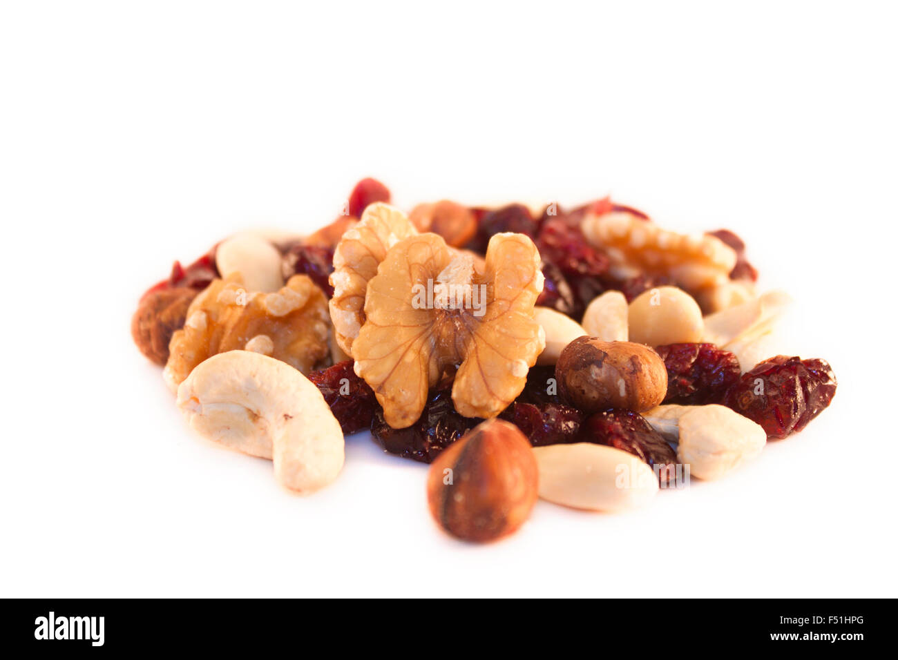 Nut mix with cranberries, isolated on white background Stock Photo - Alamy