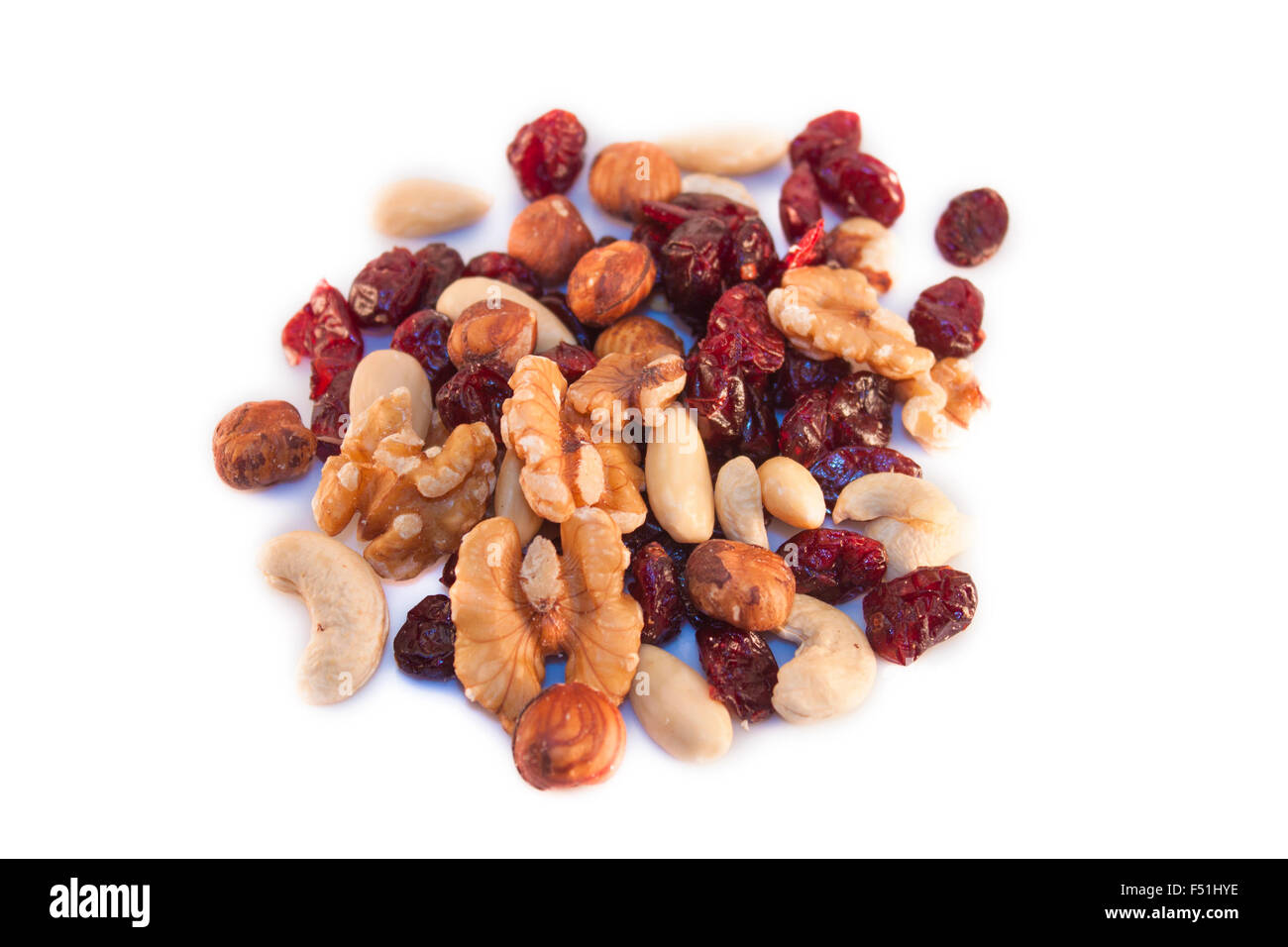 Nut mix with cranberries, isolated on white background Stock Photo - Alamy
