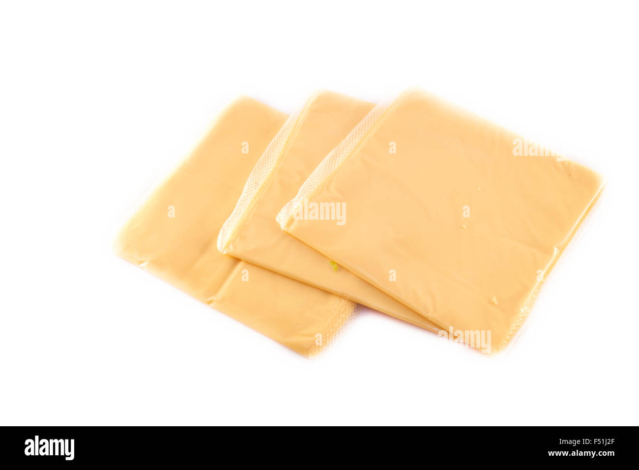 Yellow cheddar cheese slices, isolated on white background Stock Photo ...