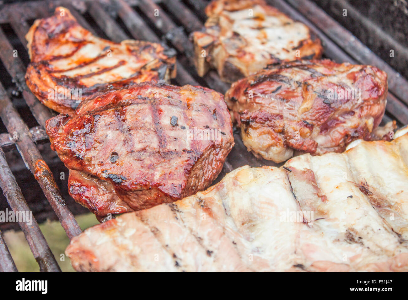 Grilled lamb steak, in between pork cutlet and ribs Stock Photo - Alamy