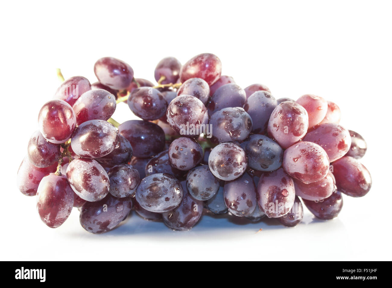 A ripe of purple grapes, isolated on white background Stock Photo - Alamy