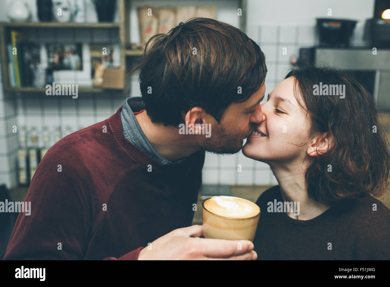 Girl kiss her boyfriend from above Stock Photo - Alamy