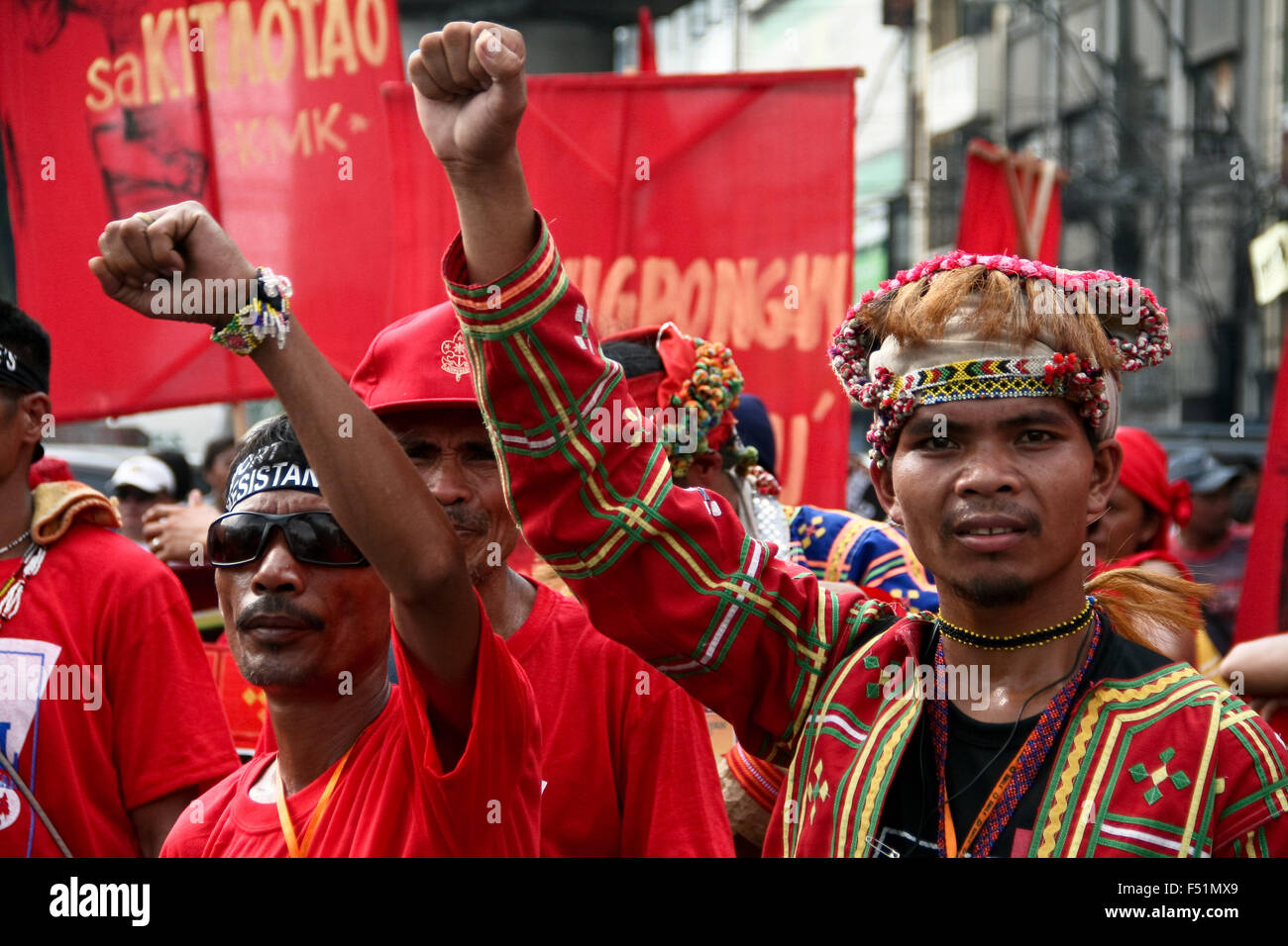 Philippines. 26th Oct, 2015. Lumad tribe members raise their fists as ...