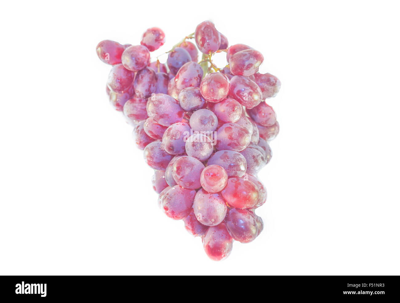 A cluster of purple grapes, isolated on white background Stock Photo ...
