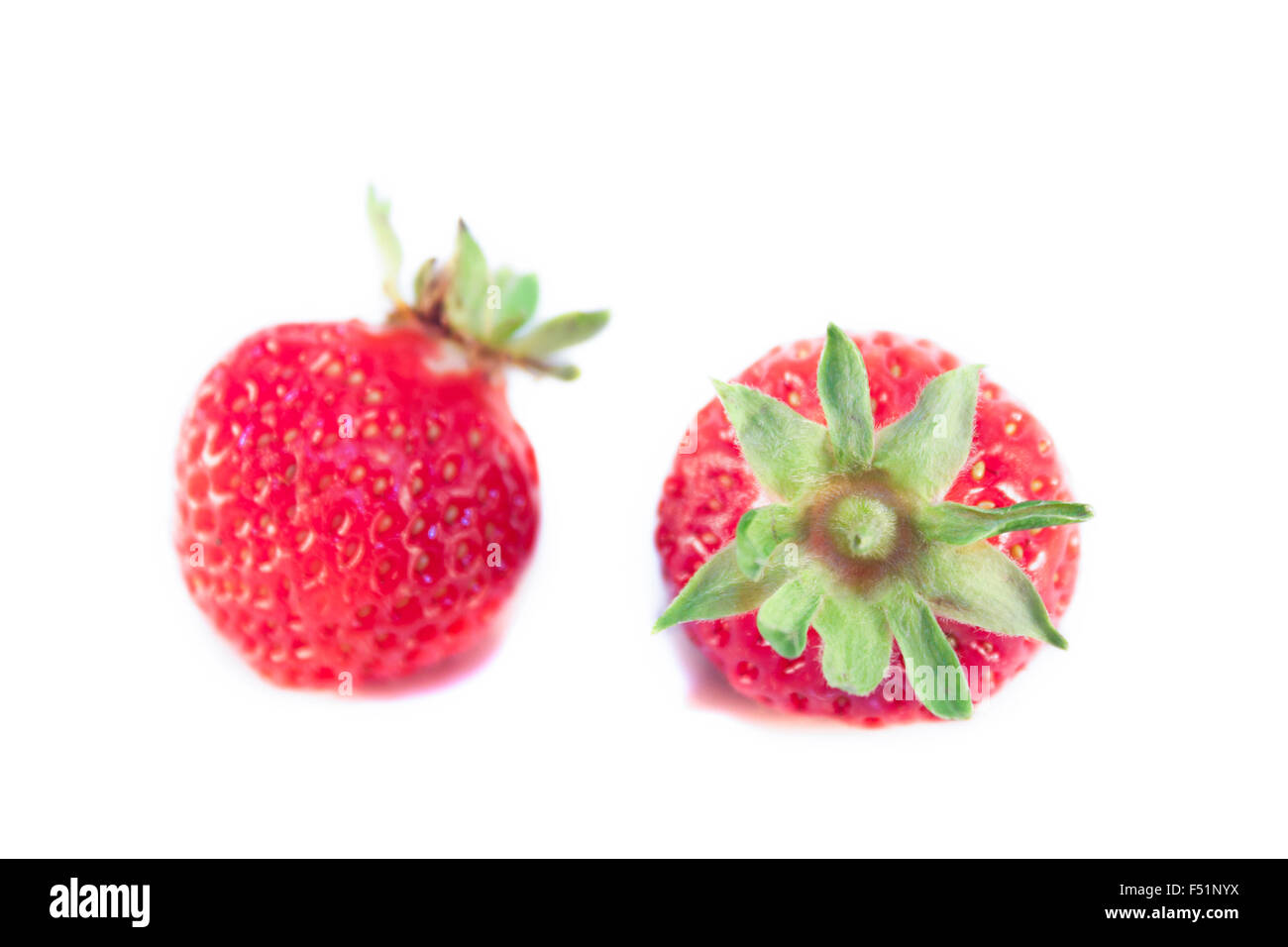 Two red strawberries, isolated on white background Stock Photo - Alamy